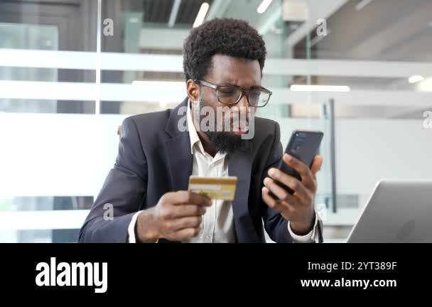 Shocked upset american businessman businessman checks his credit card ...