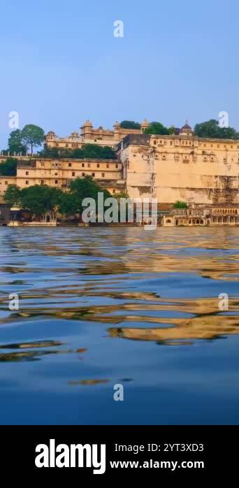 Udaipur City Palace view from lake Pichola. Luxury white palace as an ...