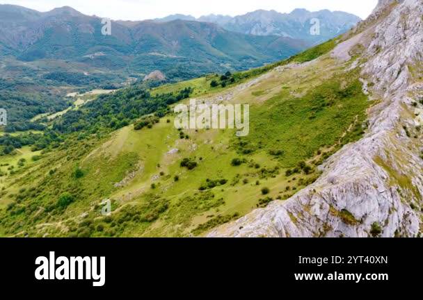 Slope of the high mountain covered with grass and bushes. Drone footage ...