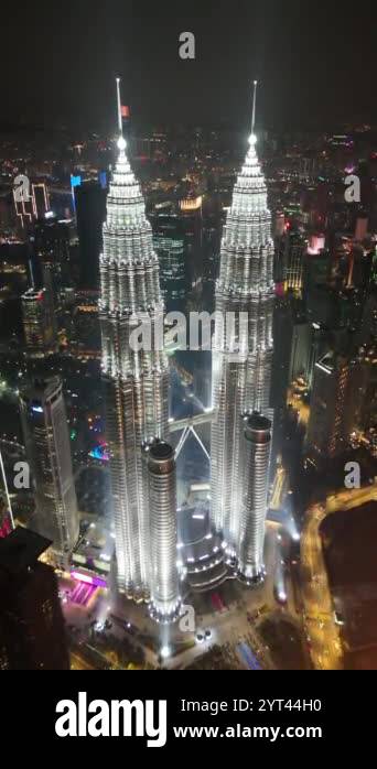 Night view of Kuala Lumpur from a drone, fly-around of the Petronas ...