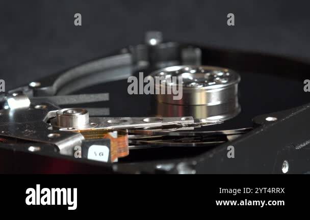 A detailed close-up image showing the inner components of a hard drive ...