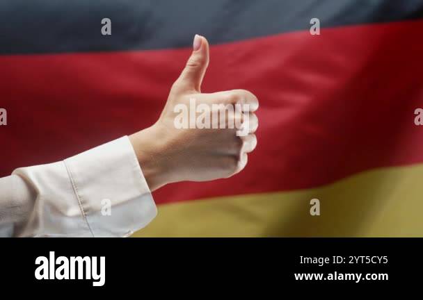 Woman Makes Hand Sign Like, Thumb Up Gesture on germany flag background ...