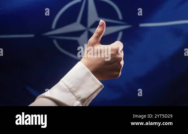 Woman Makes Hand Sign Like, Thumb Up Gesture on NATO OTAN flag ...