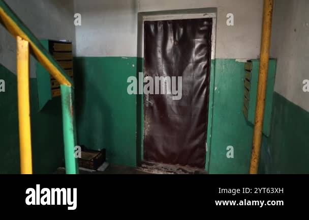 Corridor with old brown entrance doors with leatherette surface ...