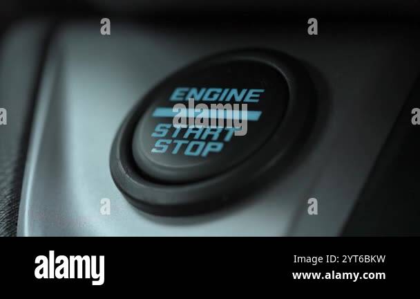 Starting car engine. Finger pushing start stop engine button. Finger ...