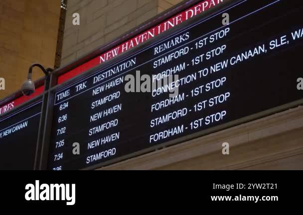 A digital train schedule display board featuring a variety of train ...