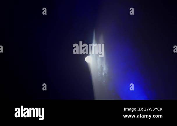 White beams of stage light in foggy studio. Bright white spotlights ...