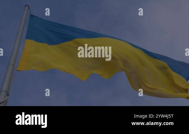 Slow motion of Ukraine flag waving background sky blue and yellow ...
