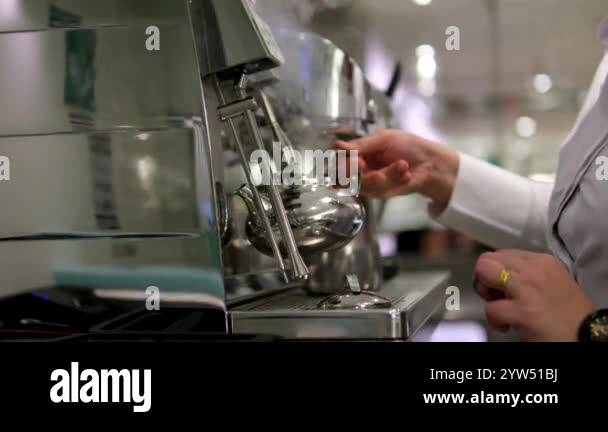 pour boiling water into a teapot restaurant make tea order at the bar ...