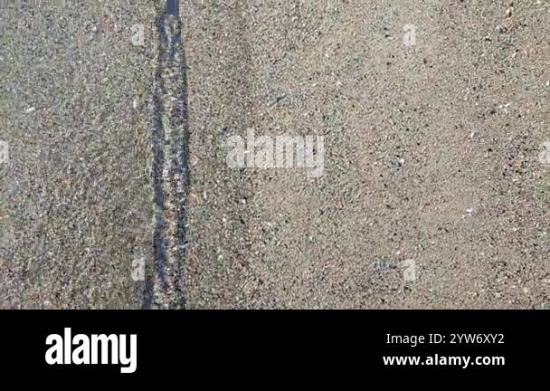 Abstract view of clean transparent water of small sea wave rolling on ...