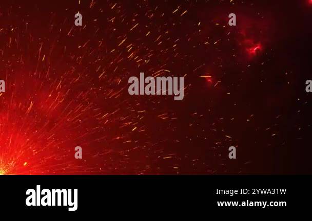 Close-up of a burning fire, bright sparks on a black background. Yellow ...