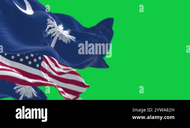 South Carolina state flags waving with the US flag isolated on green ...