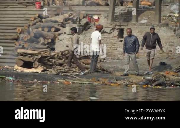 Preparation of the funeral cremation pyre at stairs of Manikarnika Ghat ...