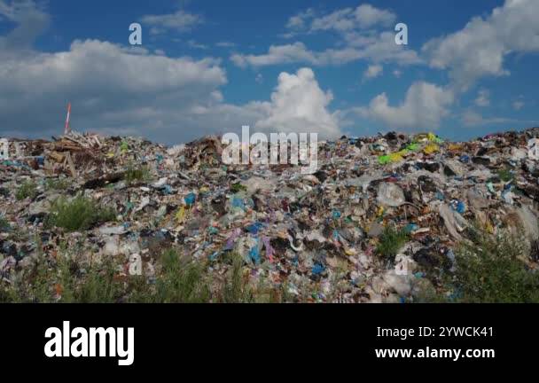 A closer look at a large landfill filled with trash and debris ...