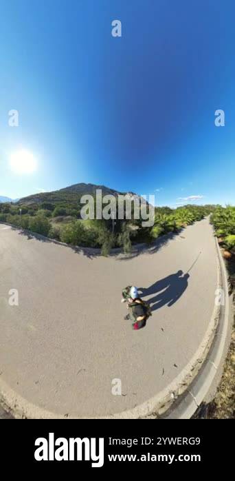 Vertical video. An aerial panoramic view of a beach promenade with palm ...
