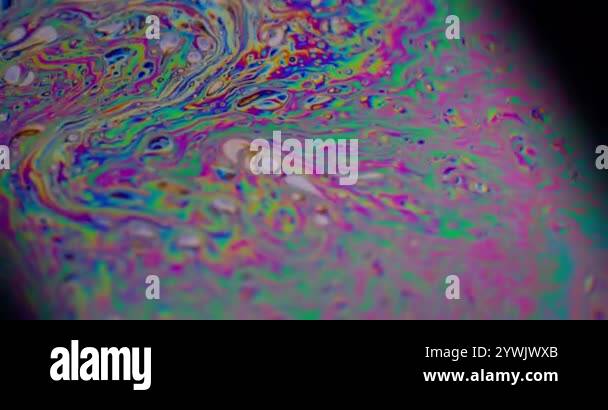 Holographic sphere. Bubble oil fluid. Defocused multicolor purple green ...