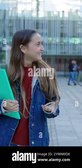 Vertical HD video of two multiracial young college students hanging out ...