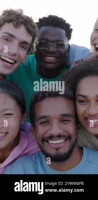 Vertical HD video of young multiracial people having fun together outdoors. Millennial diverse ...
