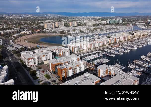 This stunning aerial view captures modern buildings that line a serene ...