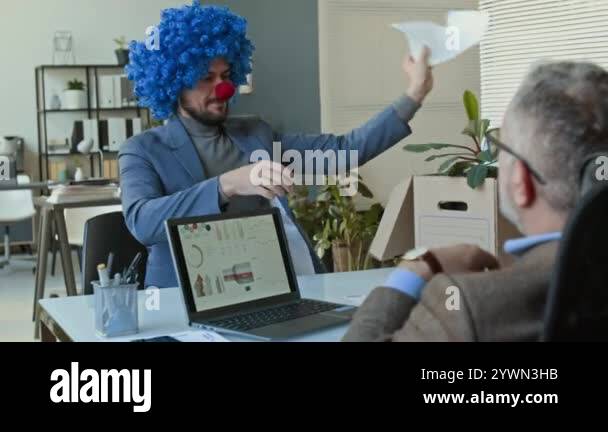 Emotional businessman removing clown wig and nose, leaving resignation ...
