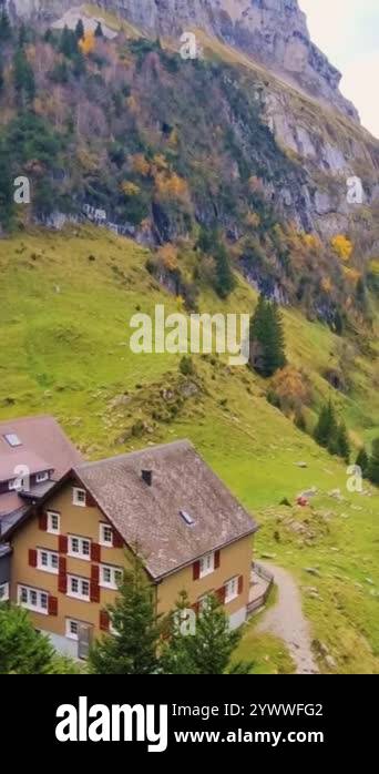 A beautiful mountain village emerges amidst stunning foliage and ...
