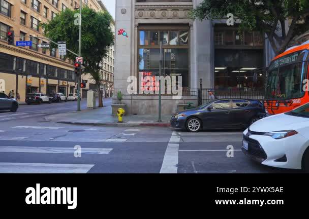 A vibrant Los Angeles street scene features The Last Bookstore, a ...