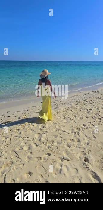 A tranquil stroll along the sandy shores of Koh Munnork Island in ...