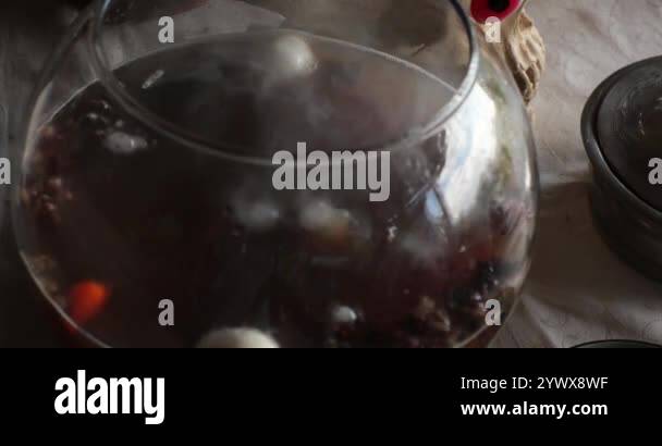 Disgusting bubbling brew in glass bowl of potion making for Halloween ...
