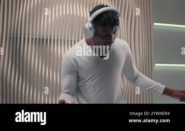 Dancing moving to music African American man indoors futurism modern ...
