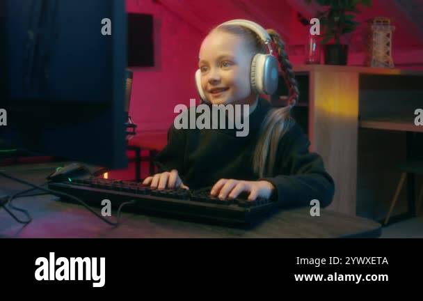 Happy smiling little Caucasian girl child kid daughter gamer in ...