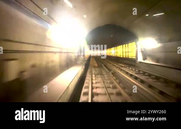 A dynamic video shows a train metro tube moving through a dark tunnel ...