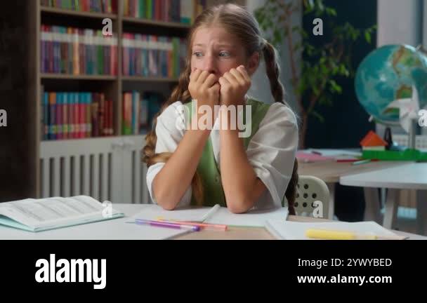 Scared worried anxious Caucasian little girl fearful frightened school ...