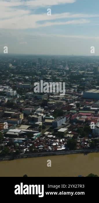 City with river, villages and commercial buildings. Davao City. Mindanao, Philippines. Vertical ...