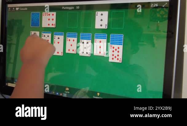 A close-up video of a childs hand interacting with a touchscreen PC ...