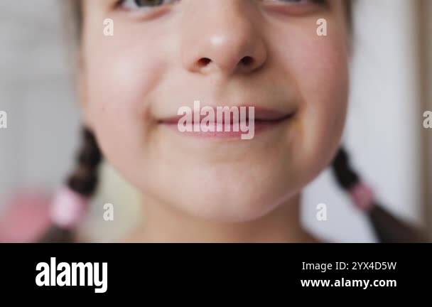 Portrait of smiling Caucasian girl with missing teeth, showing gap from ...