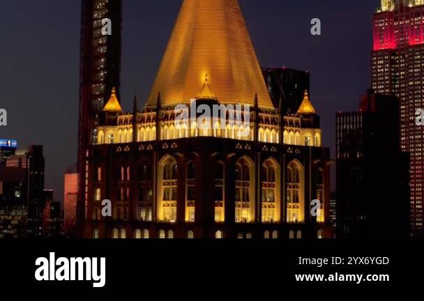 Illuminated facade and spire of the top of New York Life Building ...