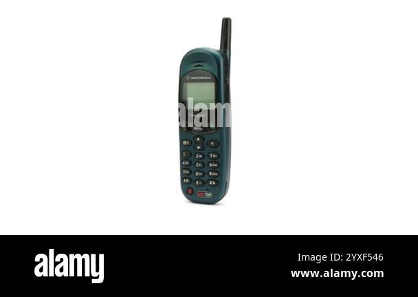 Vintage green motorola timeport cell phone rotating to show all sides ...
