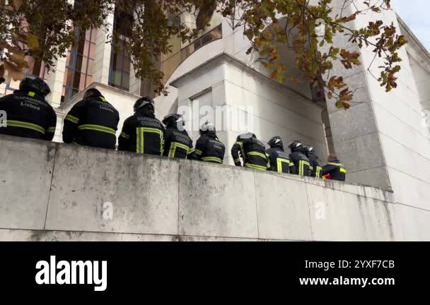 Angry crowd of firefighters are rallying in front of the city ...