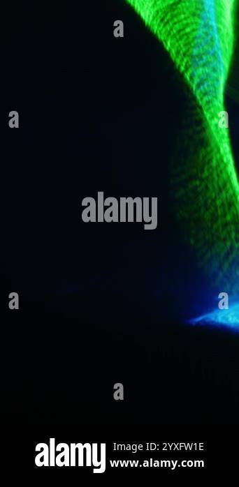 Vibrant neon green and blue waves glow brightly as they flow fluidly ...