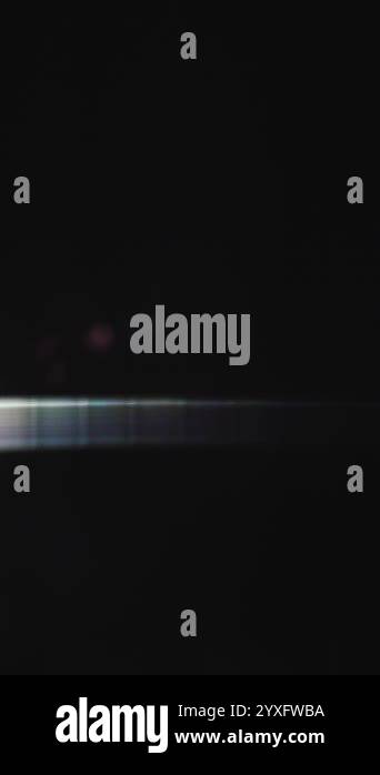 A blaze of lens flare reveals a striking visual where elongated beams ...