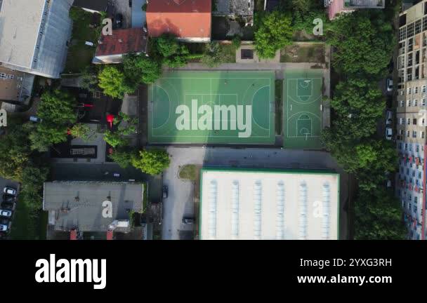 football field in the courtyard of tall buildings. High quality 4k ...