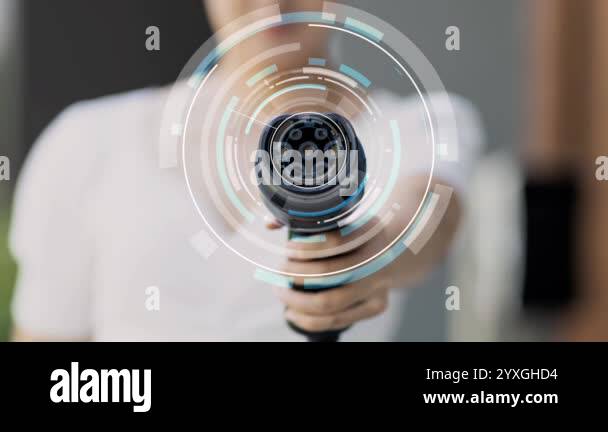 Focus EV charger pointing in front of camera display futuristic eco ...