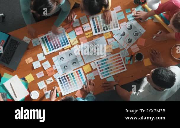 Top down view of designer compare color palettes with laptop and design ...