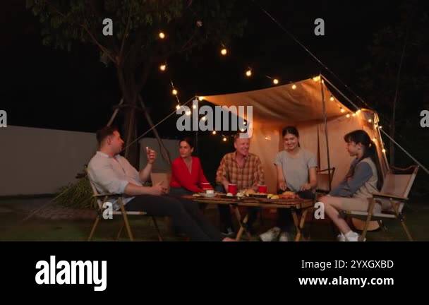 Family together celebrate holiday in garden. Family member gathering ...