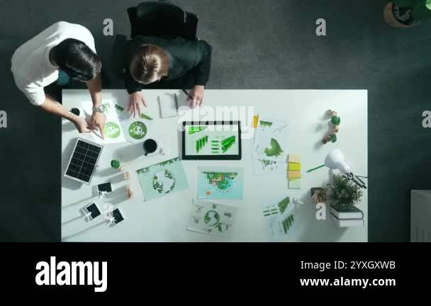 Top down view of business man presenting sustainable idea to manager by ...