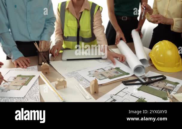 Smart architect and safety engineer discussion about building blueprint ...