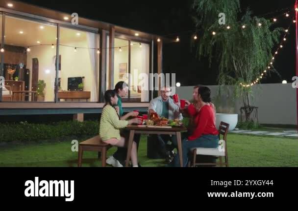 Family cheers with glass to celebrate holiday. Parents, grandparents ...