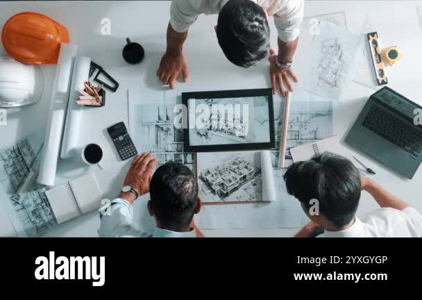Top down view of professional manager look at plan while designer hold ...
