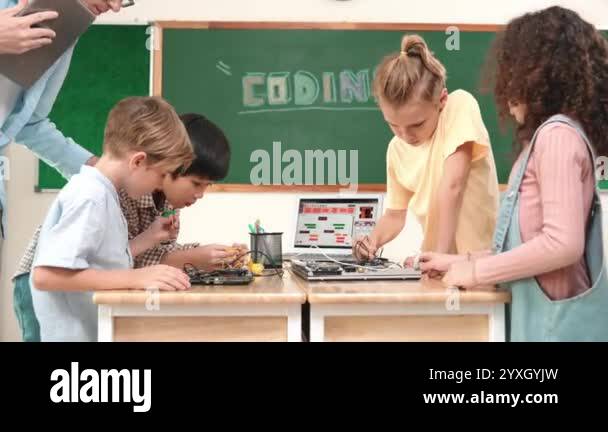 Group of diverse student working together on main board with laptop ...