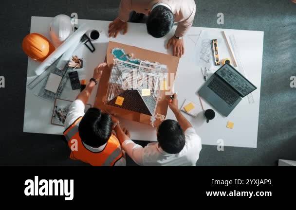 Top down aerial view of architect writing sticky note and placed at ...